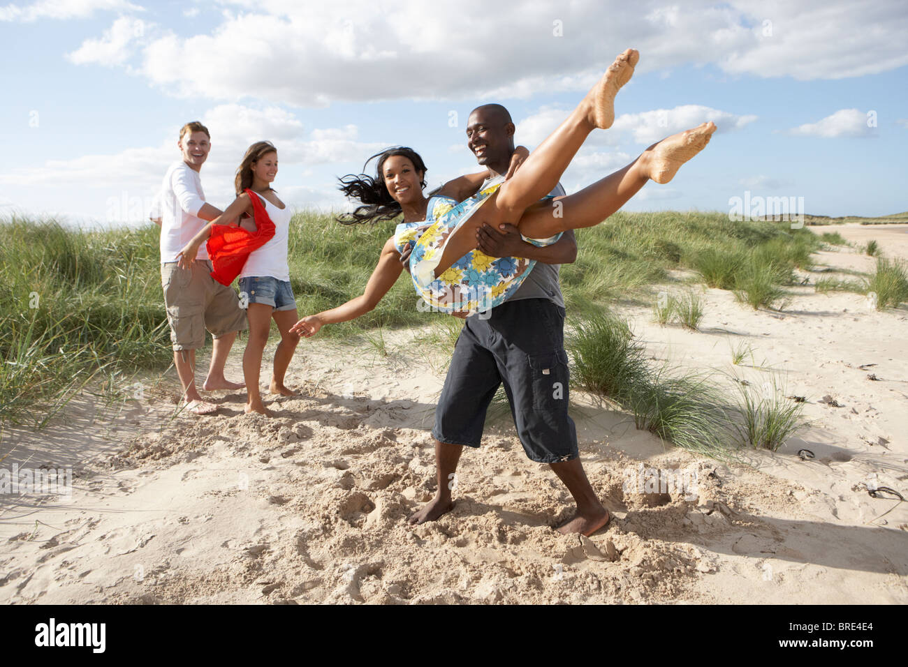 Group Of Young People Having Fun Dancing On Beach Together Stock Photo ...
