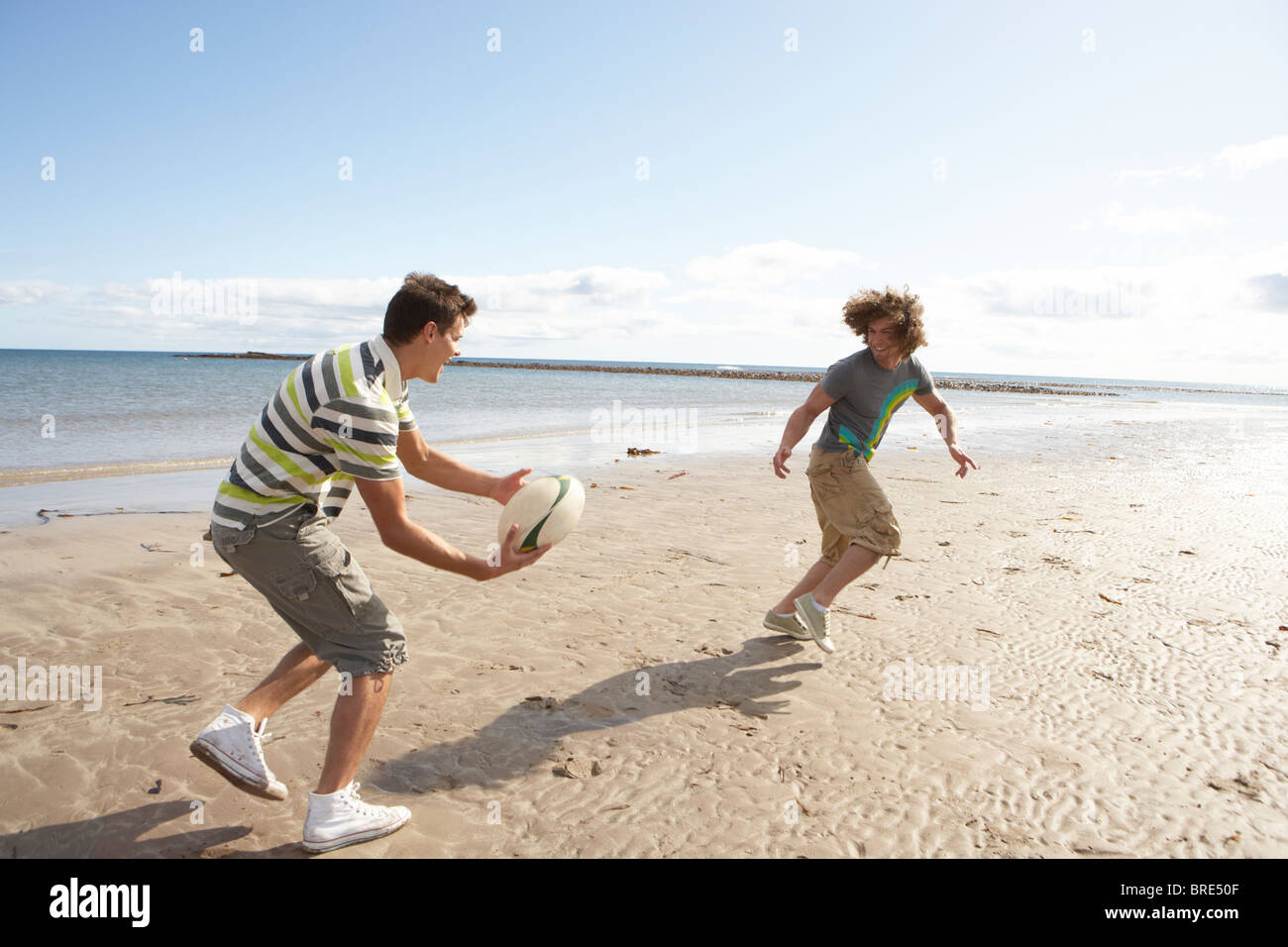 Two teenage boys playing rugby hi-res stock photography and images - Alamy