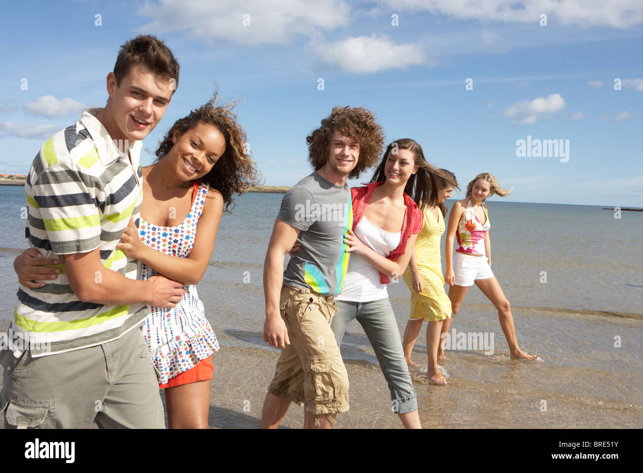 Teenage friends walking beach hi-res stock photography and images - Alamy