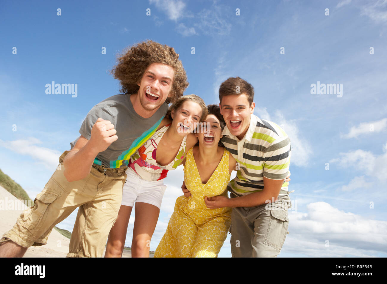 Group Of Friends Having Fun On Summer Beach Stock Photo - Alamy