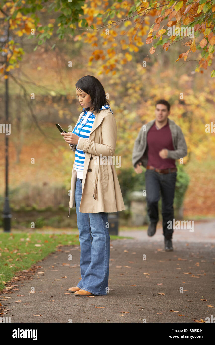Teenage Girl Making Mobile Phone Call With Boyfriend Running Towards ...