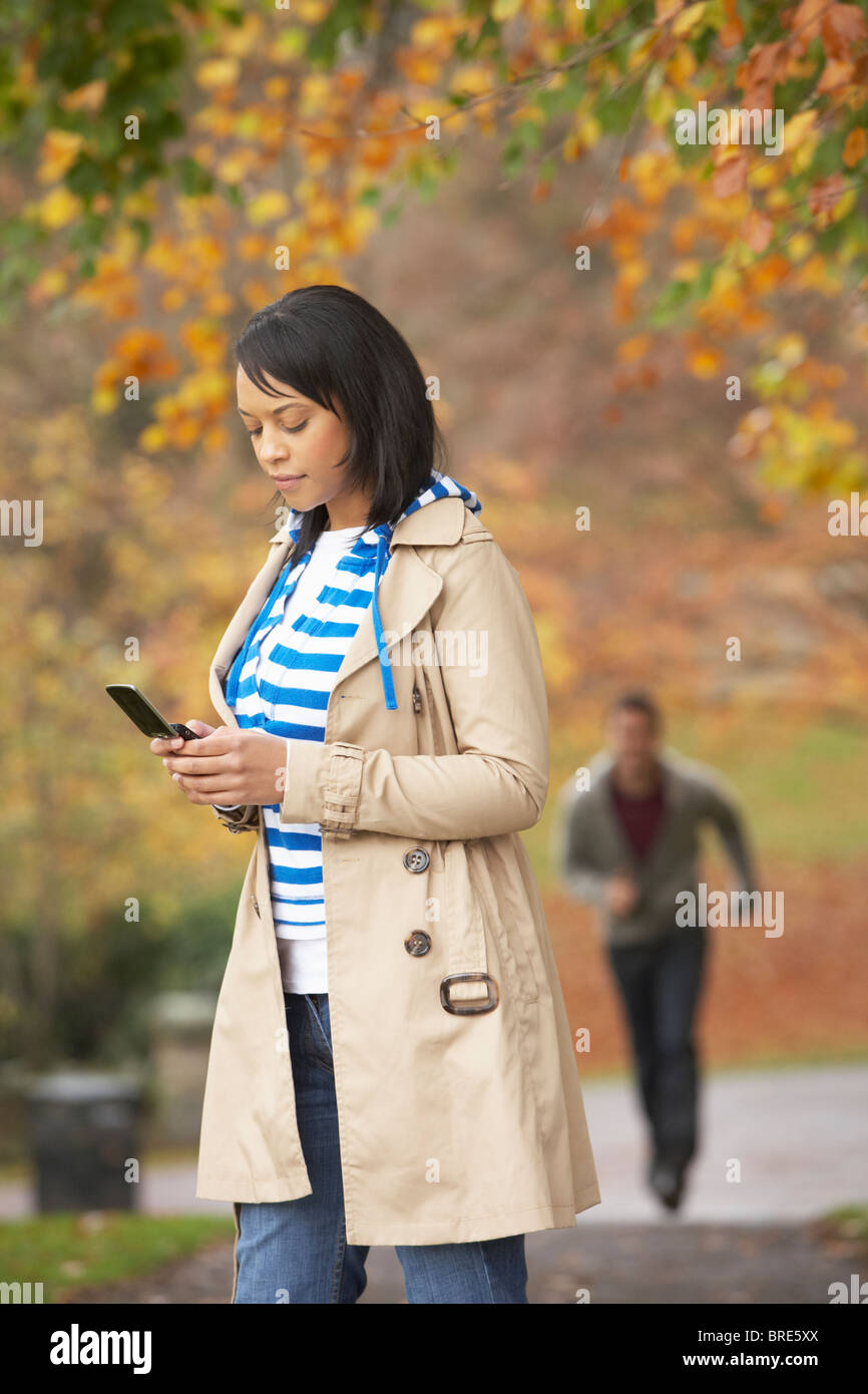 Teenage Girl Making Mobile Phone Call With Boyfriend Running Towards ...