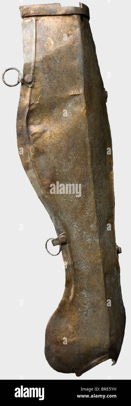 A Roman greave, 2nd/3rd century A.D. Essentially undecorated, brass ...