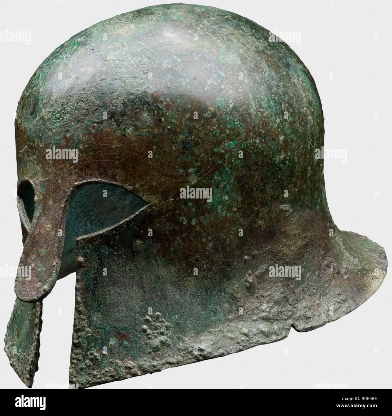 A Corinthian helmet, 6th century B.C. Heavy bronze helmet with a short ...