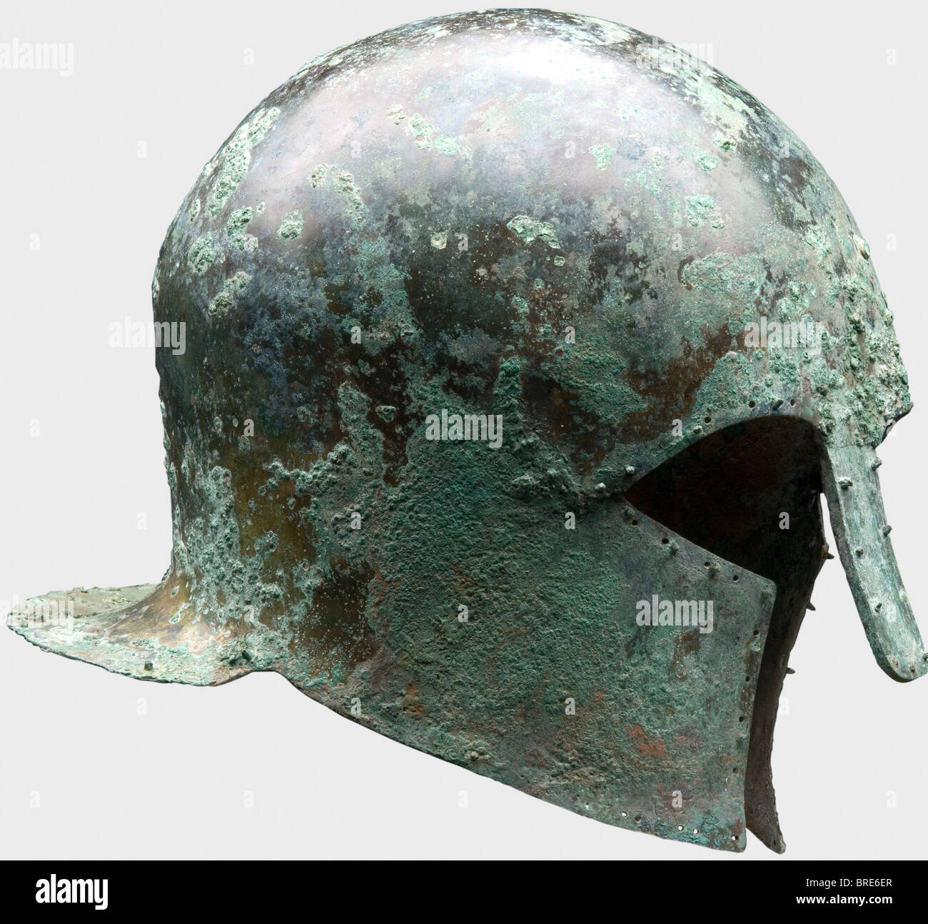 A Corinthian helmet, 7th/6th century B.C. Thick-walled, heavy, bronze ...