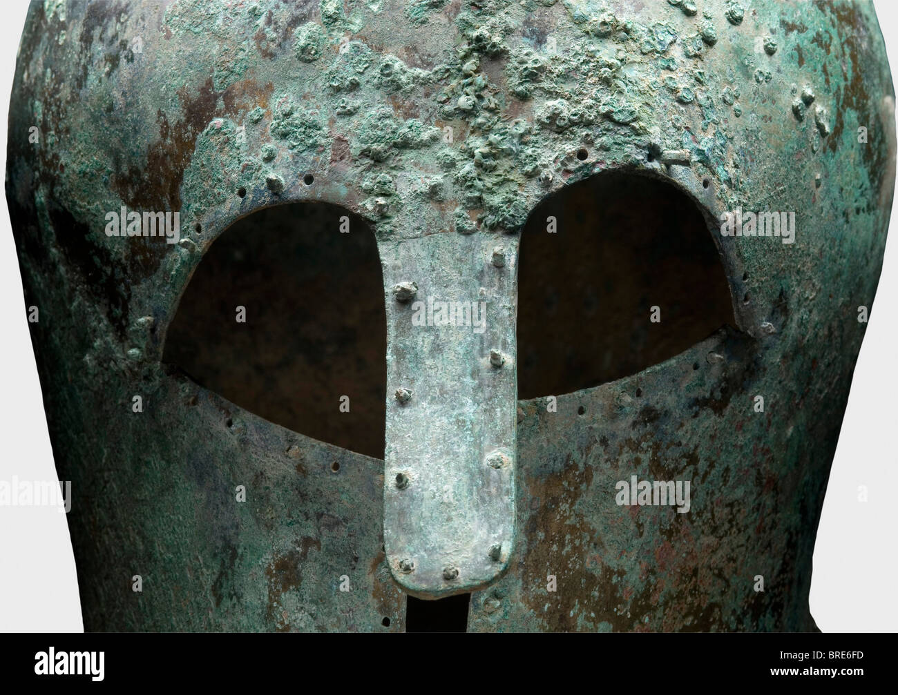 A Corinthian helmet, 7th/6th century B.C. Thick-walled, heavy, bronze ...