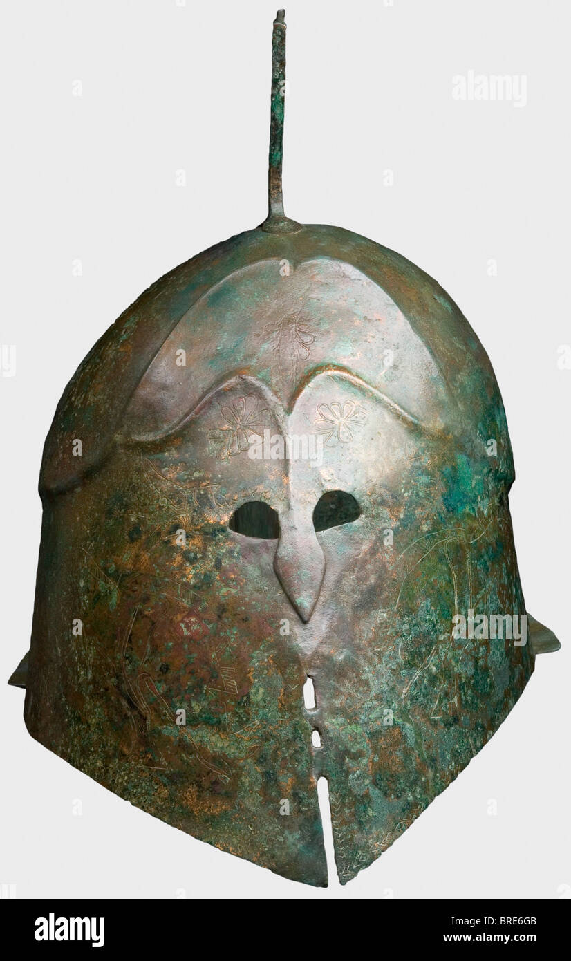An Apulian-Corinthian helmet, 6th/5th century B.C. Tall bronze skull ...