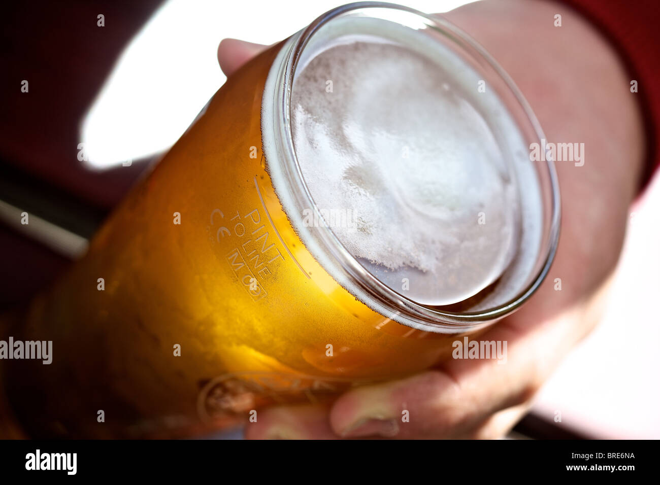man drinking a pint of lager Stock Photo - Alamy