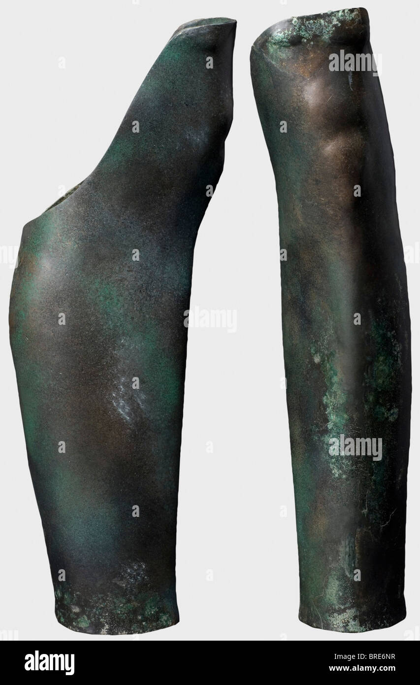Two Greek greaves, 5th/4th century B.C. Tubular, bronze greaves moulded ...