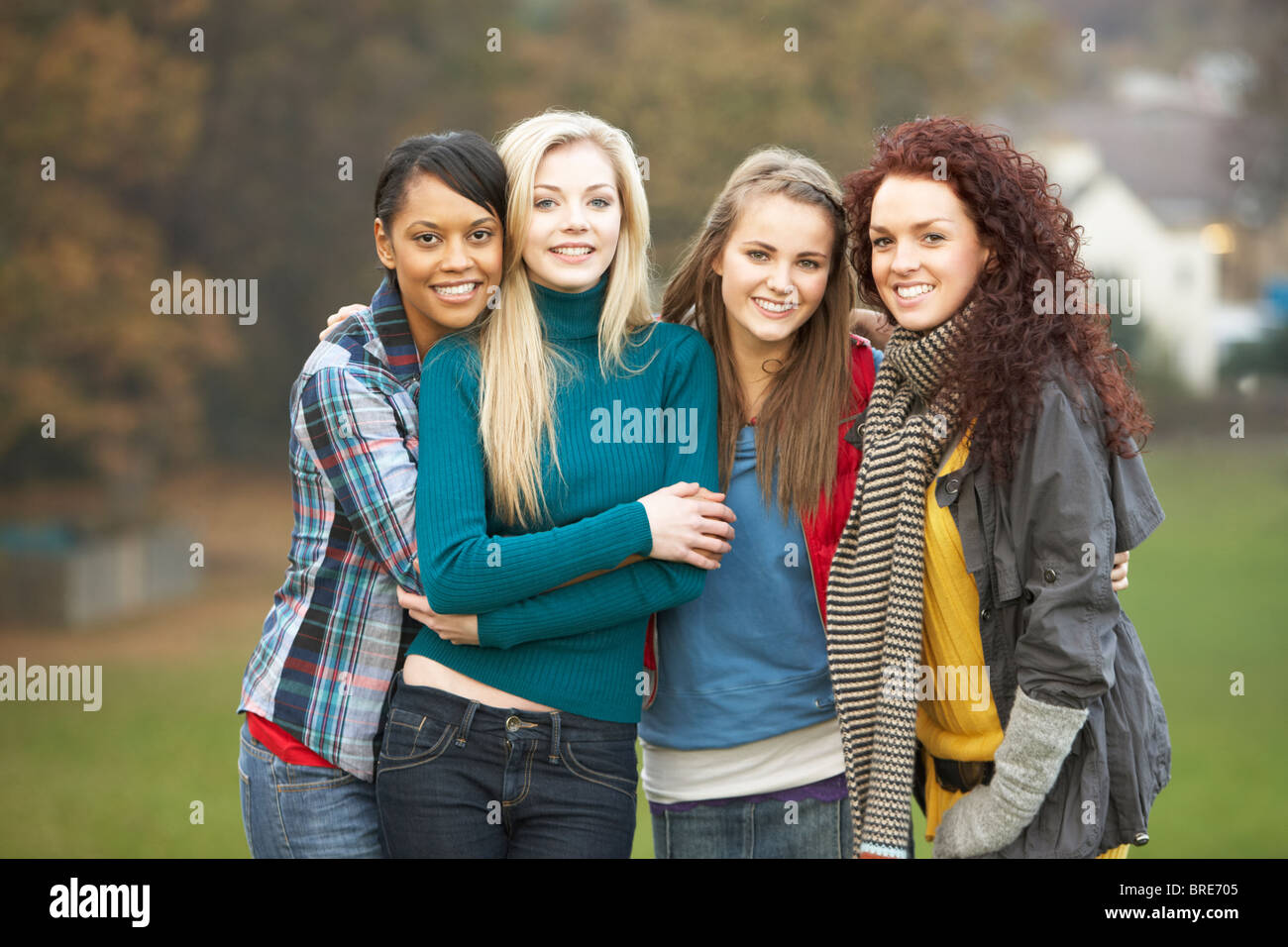 Group Of Four Teenage Girls In Autumn Landscape Stock Photo - Alamy