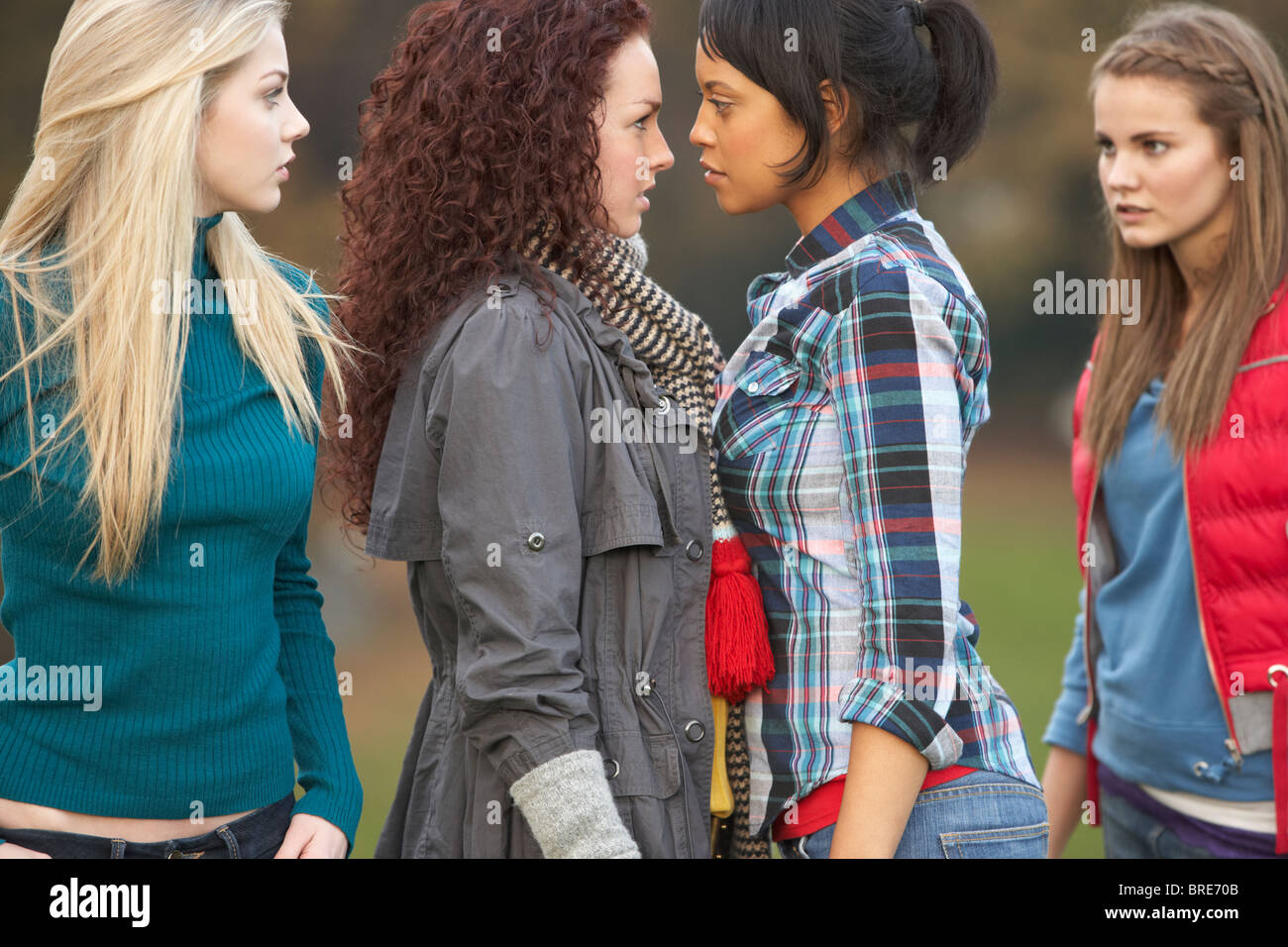 Group Of Confrontational Teenager Girls Stock Photo - Alamy