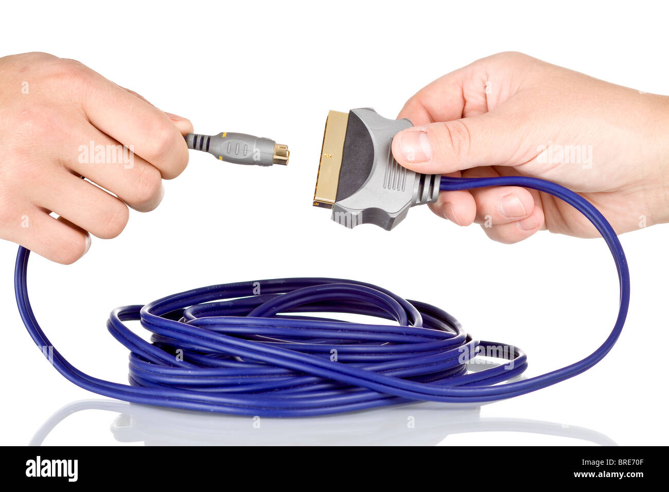 Hands connecting two cables on white background Stock Photo - Alamy