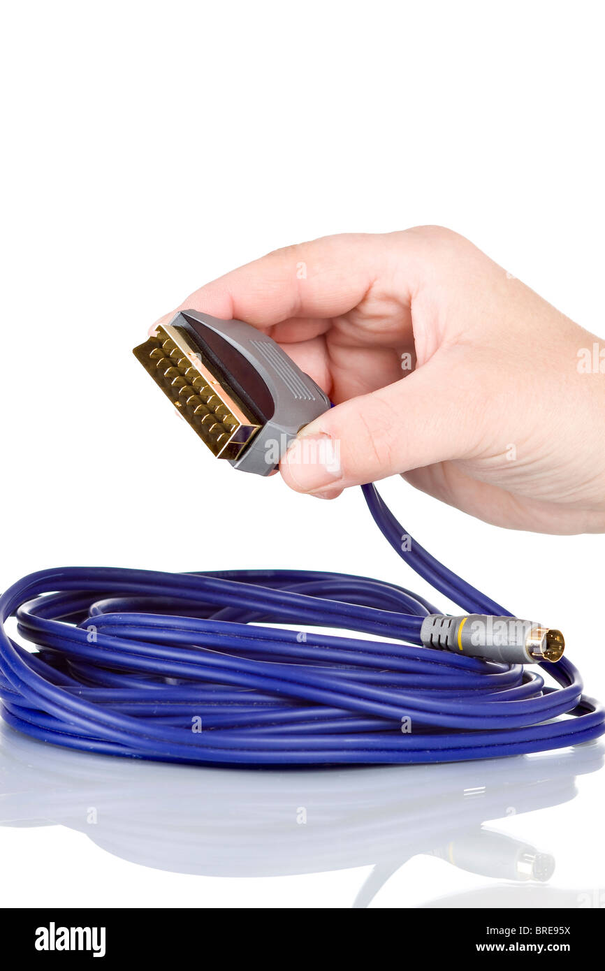 Hand holding audio video cable on white background Stock Photo - Alamy