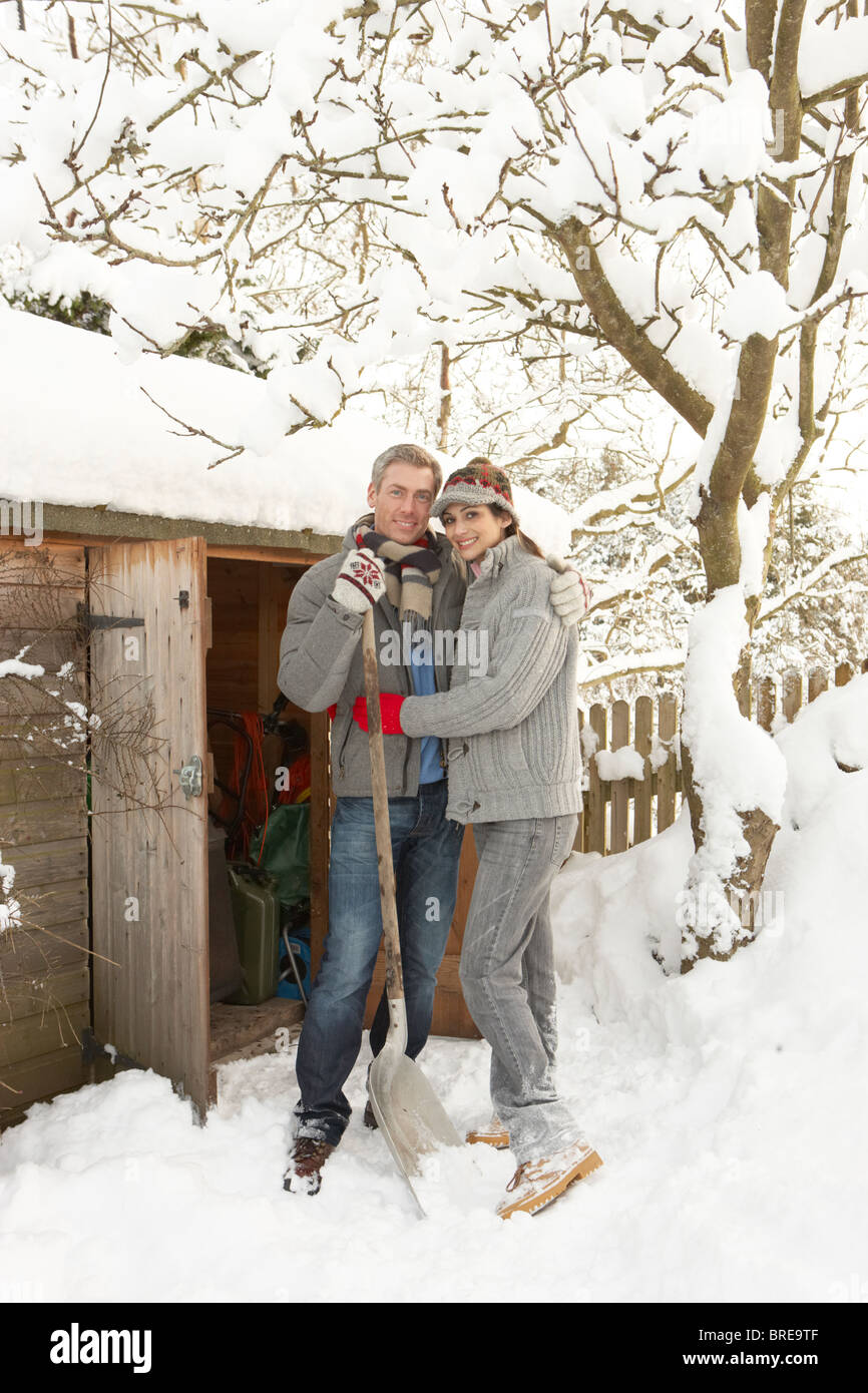 Woman clearing path of snow hi-res stock photography and images - Alamy