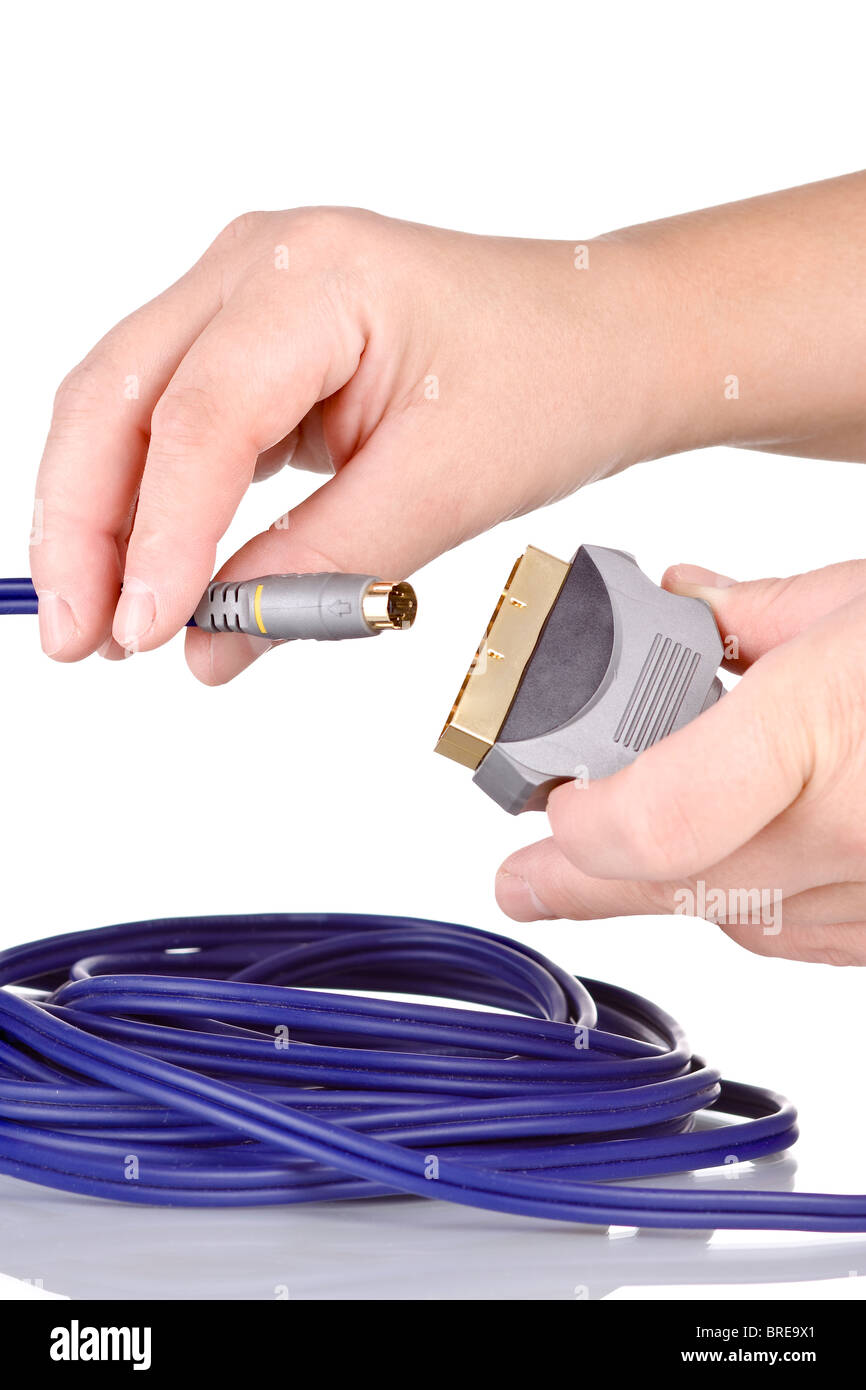 Connecting two audio cables on white background Stock Photo - Alamy