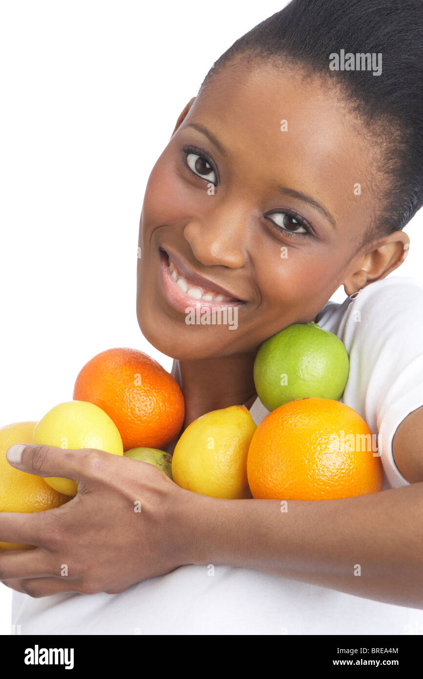 Young Woman Holding Citrus Fruit In Studio Stock Photo - Alamy