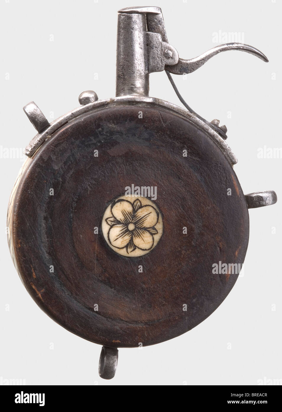 A German priming flask, circa 1590. Hemispherical body with inlays of ...