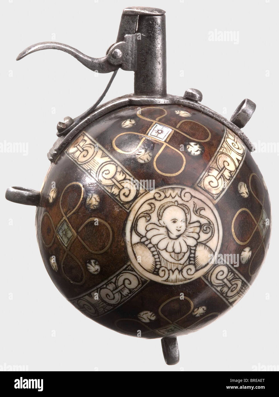 A German priming flask, circa 1590. Hemispherical body with inlays of ...