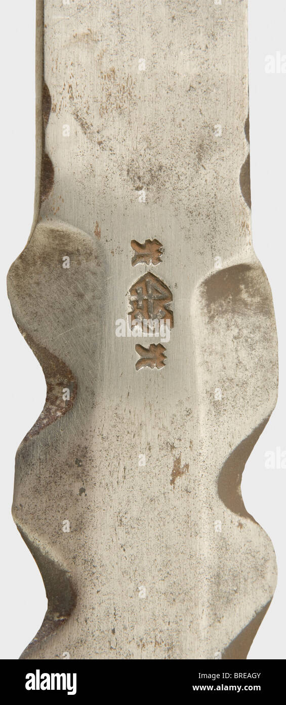 A German two-handed sword, middle of the 16th century Double-edged wavy ...