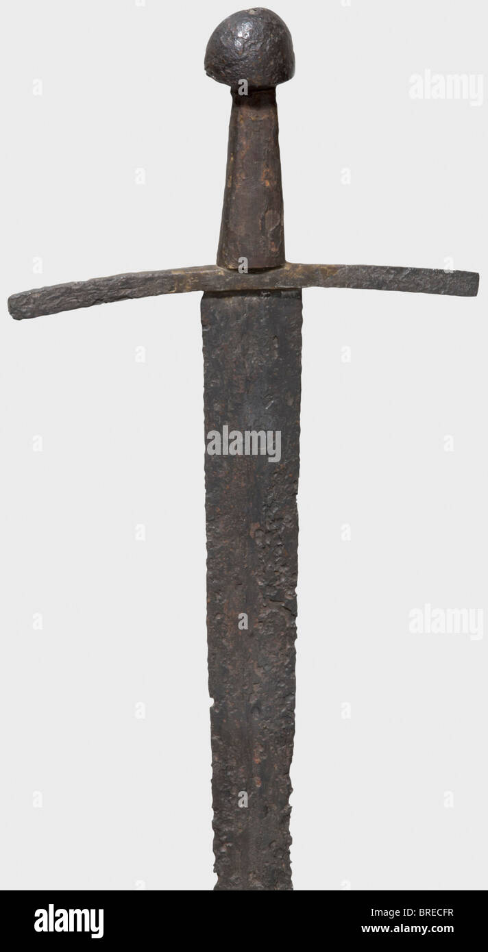 A German knightly sword, circa 1100 A heavy, double-edged blade with ...