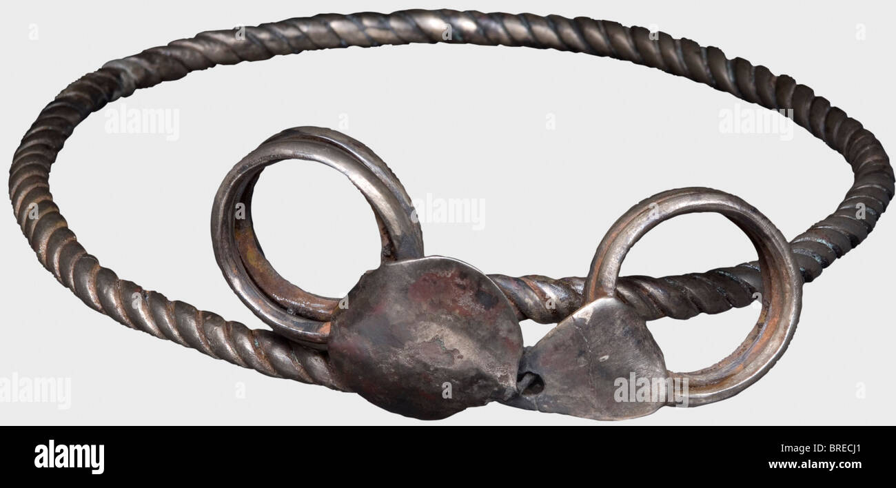 A Celtic silver set consisting of a torque and a pair of crossbow ...