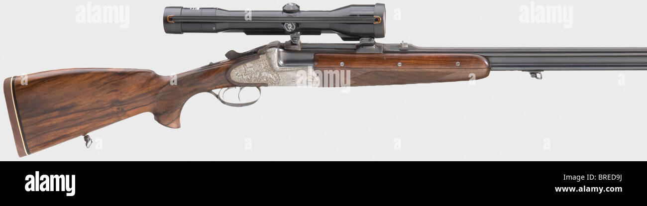 A deluxe over-and-under rifle with two spare barrels, A. Kuchenreuther ...