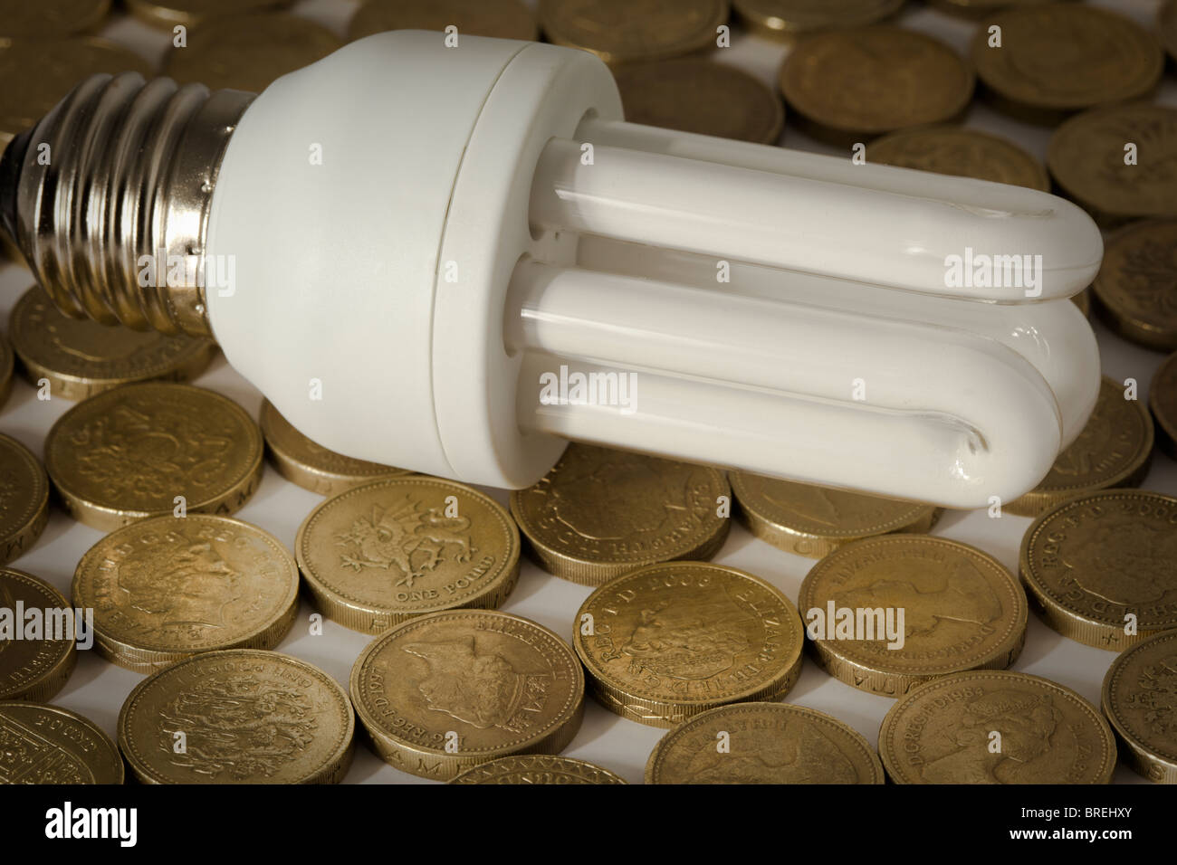 Light bulb on coins hi-res stock photography and images - Alamy