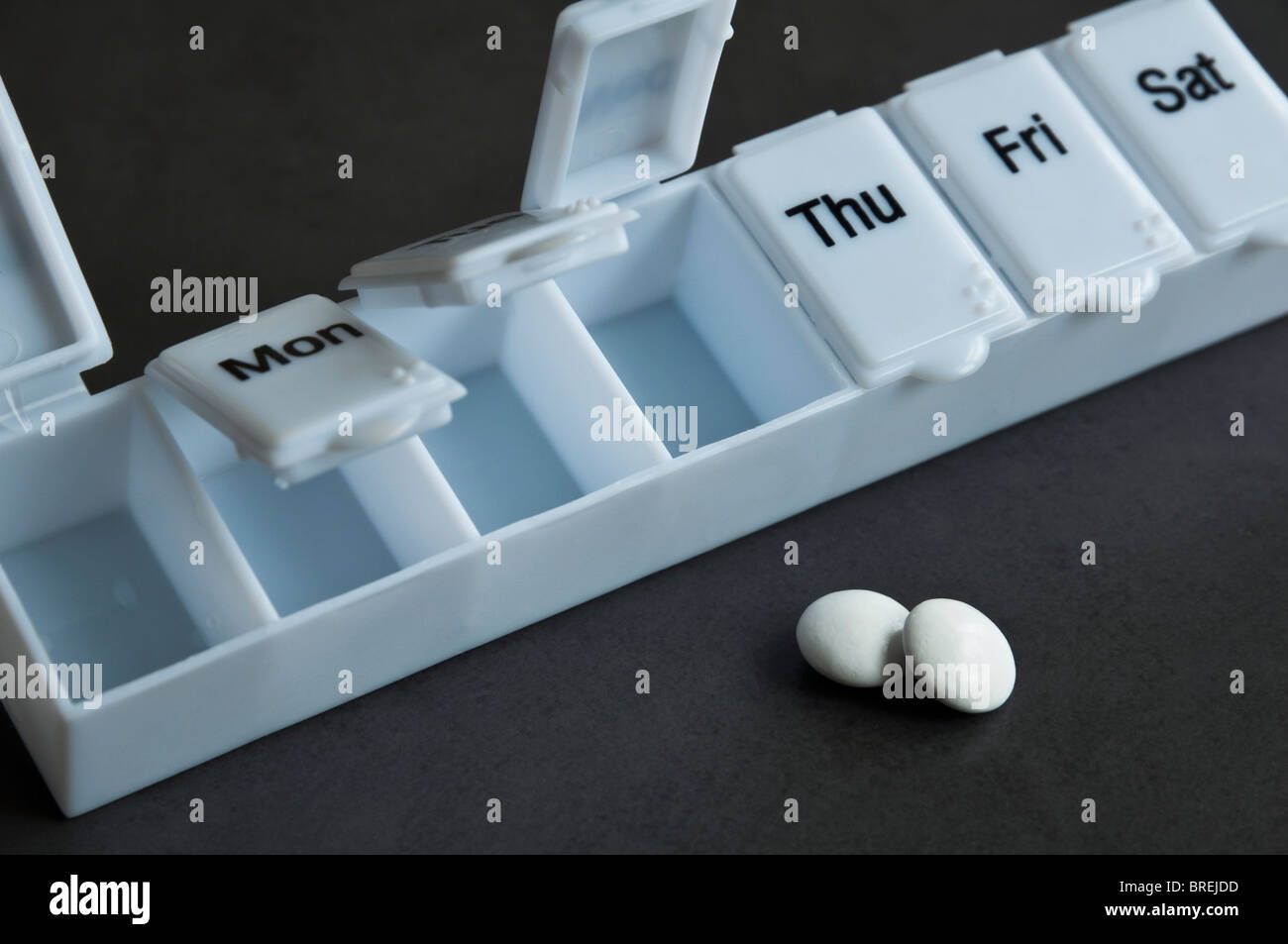 Daily / Week tablet dispenser - with two tablets on a black background ...