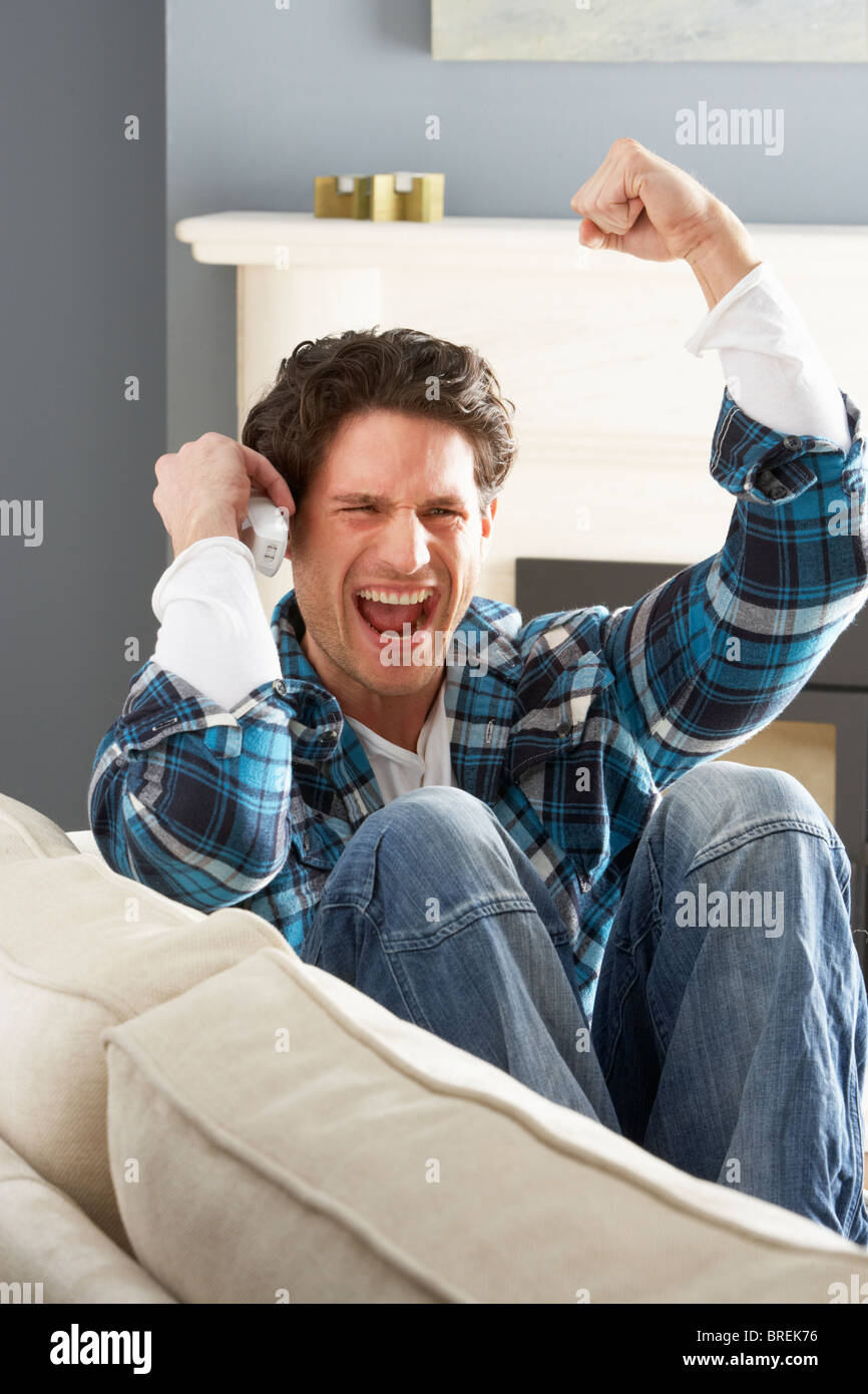 Excited man with phone hi-res stock photography and images - Alamy