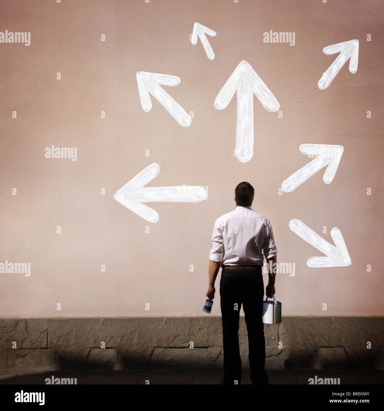 man with arrows painted on a wall Stock Photo - Alamy