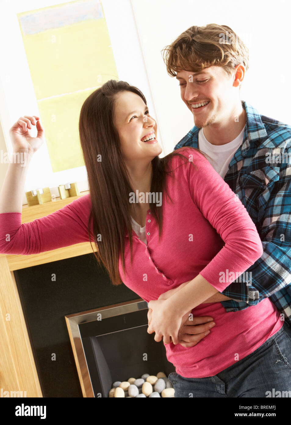 Romantic Young Couple Dancing Together In Living Room Stock Photo - Alamy