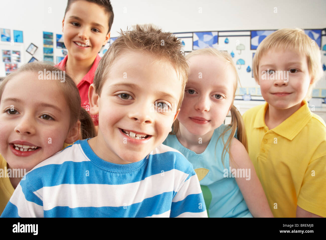 Group Of Primary Schoolchildren In Classroom Stock Photo - Alamy