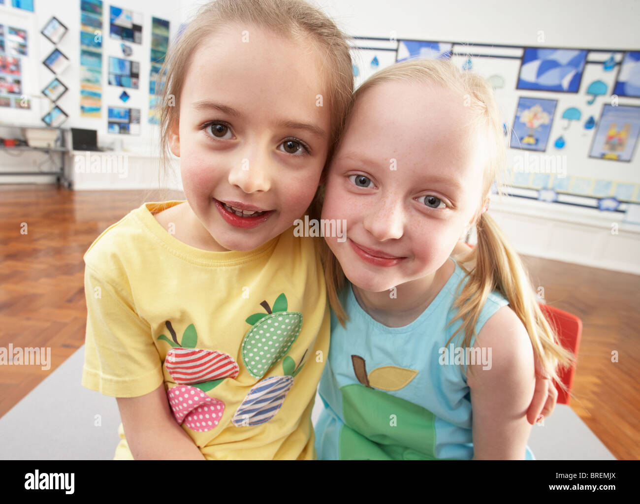 Two Female Primary Schoolchildren In Classroom Stock Photo - Alamy