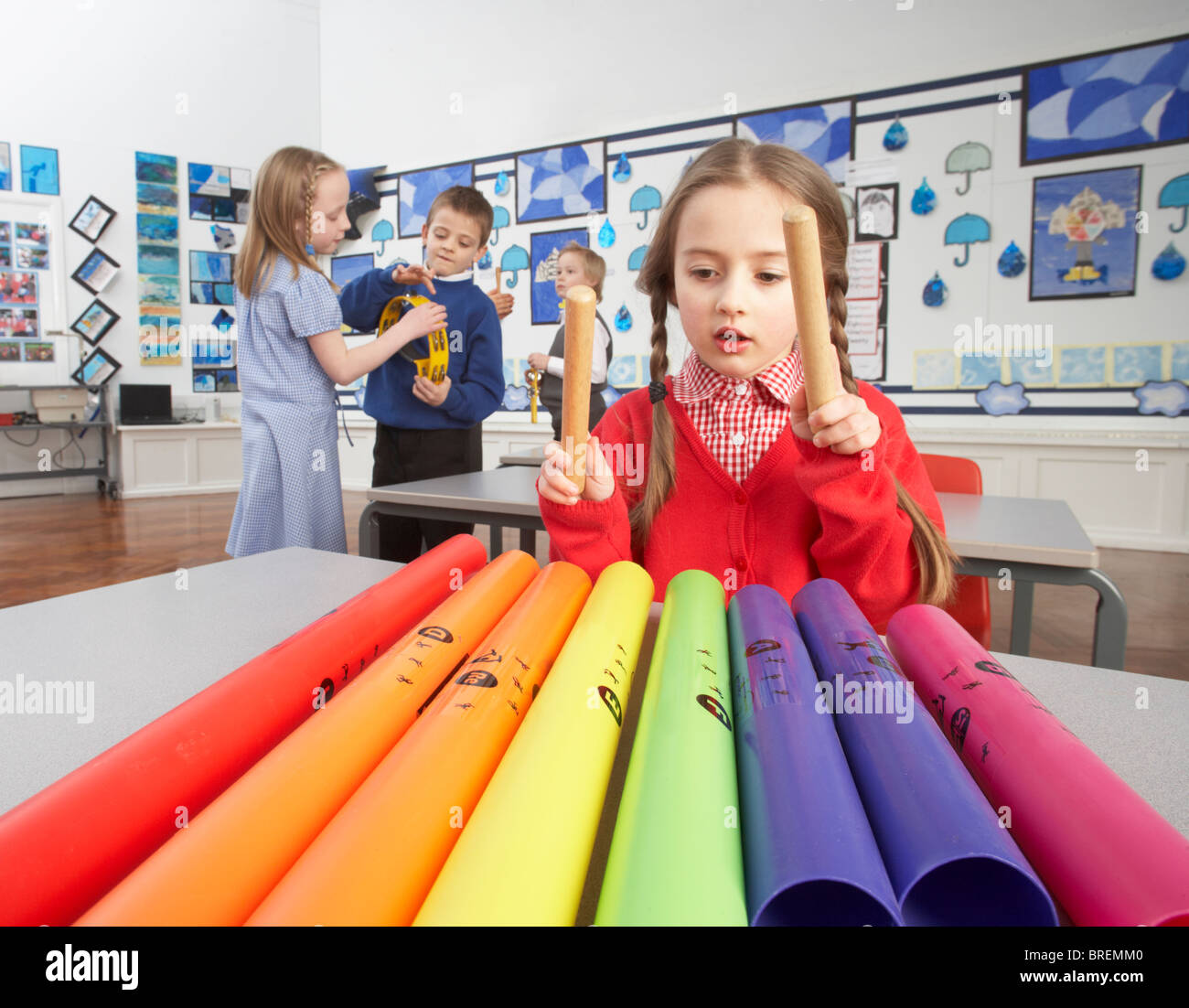 Group Of Primary Schoolchildren Having Music Lesson In Classroom Stock ...