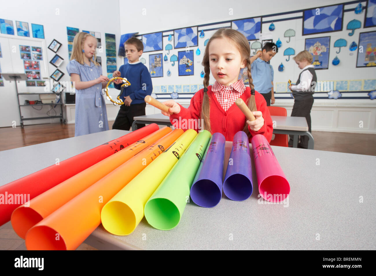 Group Of Primary Schoolchildren Having Music Lesson In Classroom Stock ...