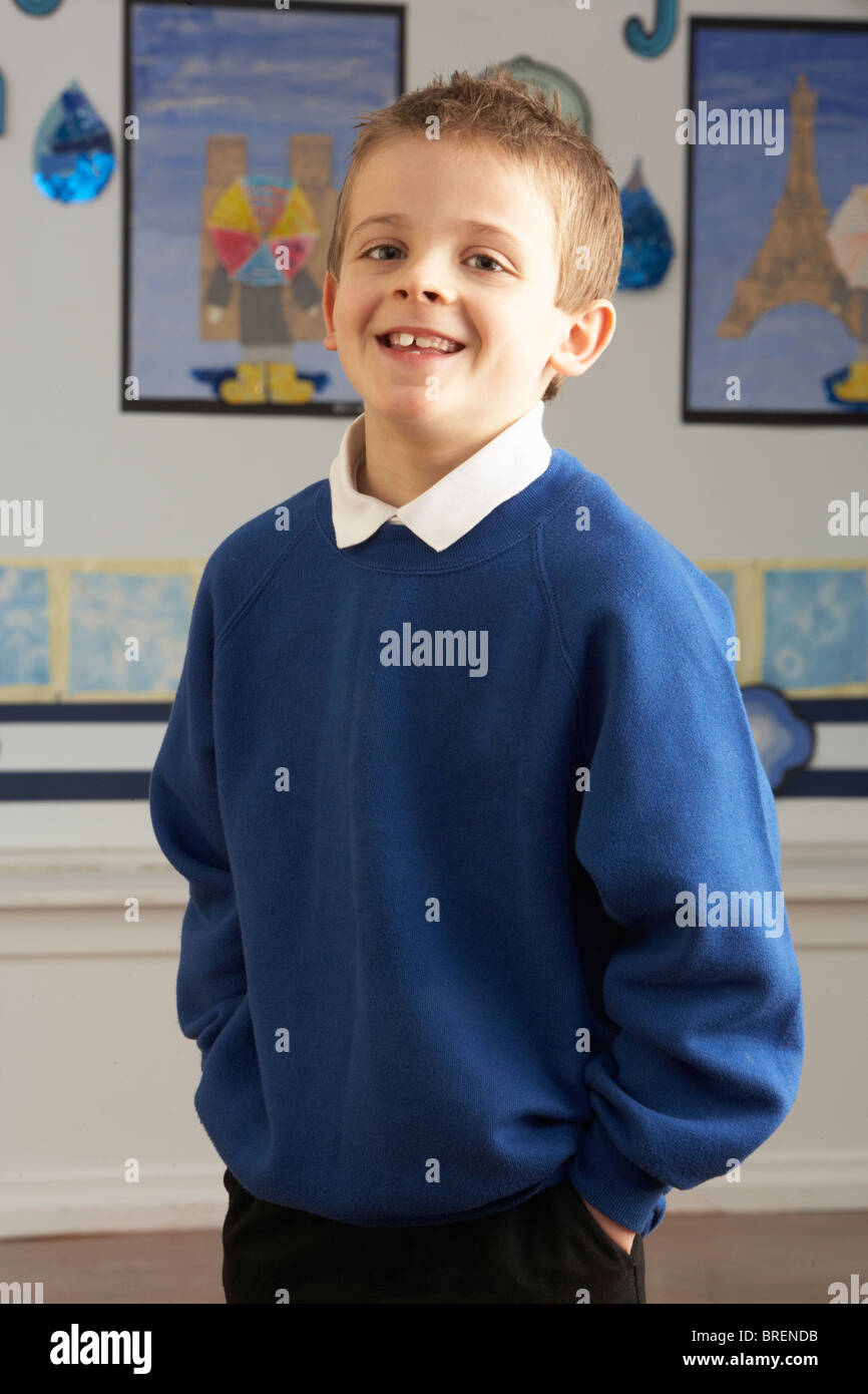 Portrait Of Male Primary School Pupil Standing In Classroom Stock Photo ...