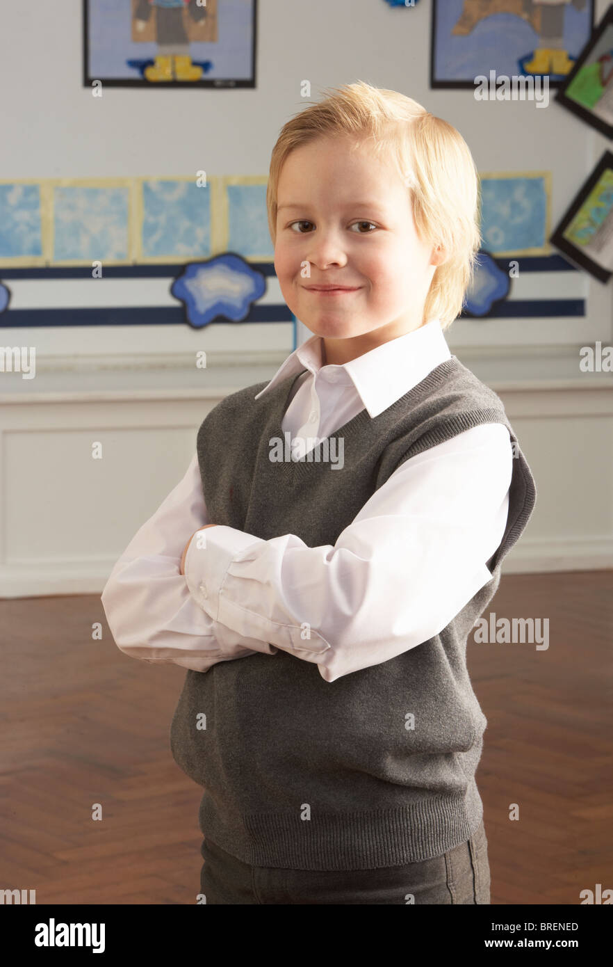 Portrait Of Male Primary School Pupil Standing In Classroom Stock Photo ...