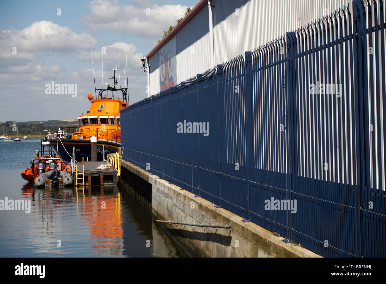 RNLI boat moored alongside RNLI building in Poole Stock Photo - Alamy
