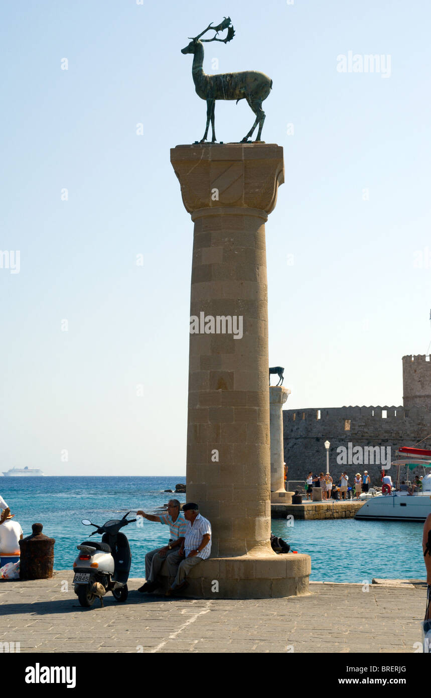platoni statue at enterance to mandraki harbour rhodes dodecanese ...