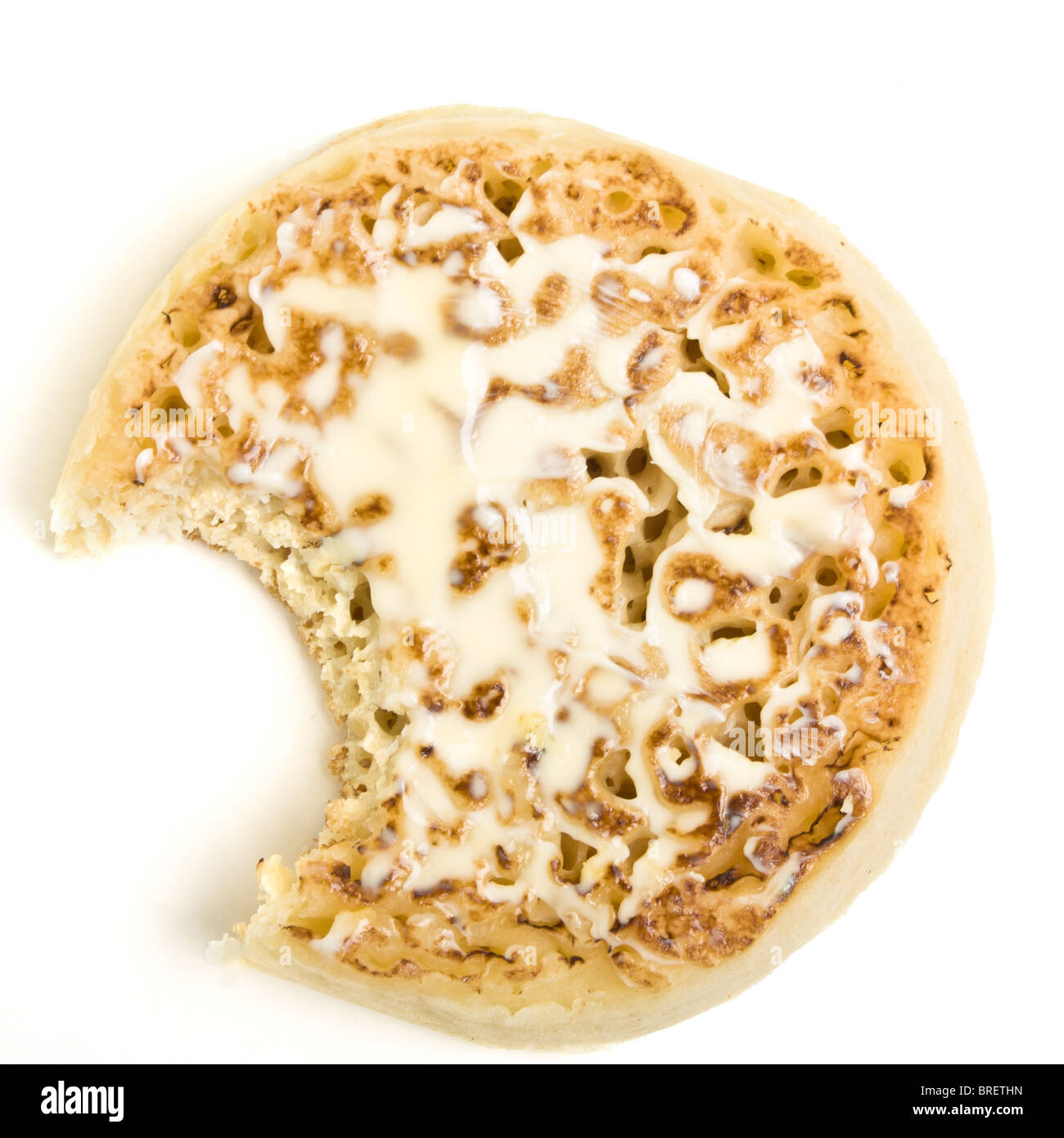 Traditional English Hot Buttered Crumpet with melting butter Stock ...