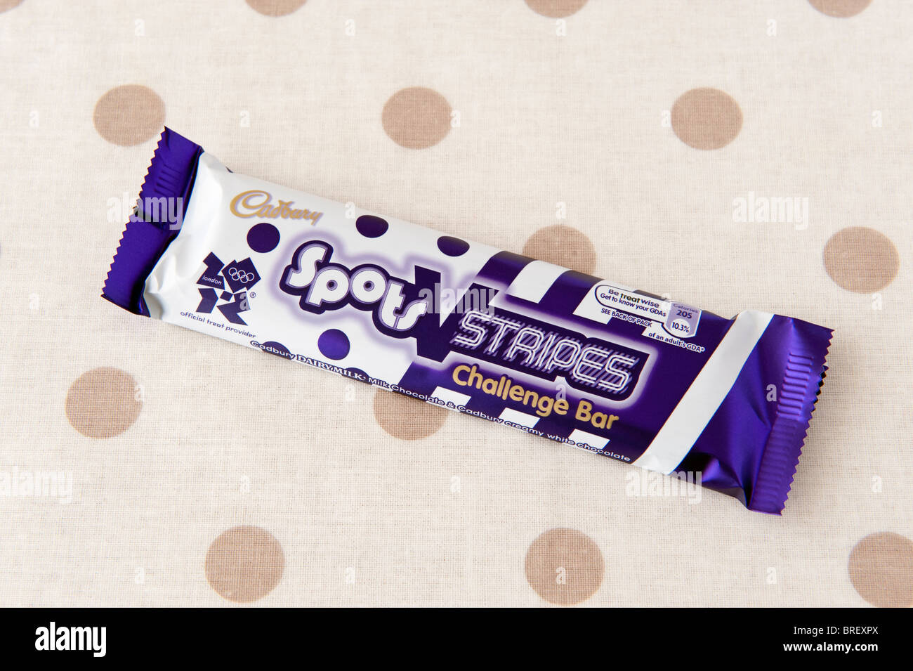 Bar of Cadbury spots and stripes challenge chocolate bar on a plastic ...