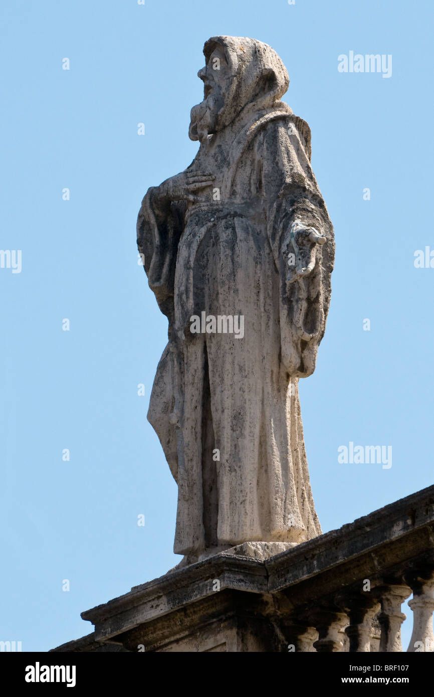 Sculpture (statue) of saints on top and around the Basilica Saint Peter ...