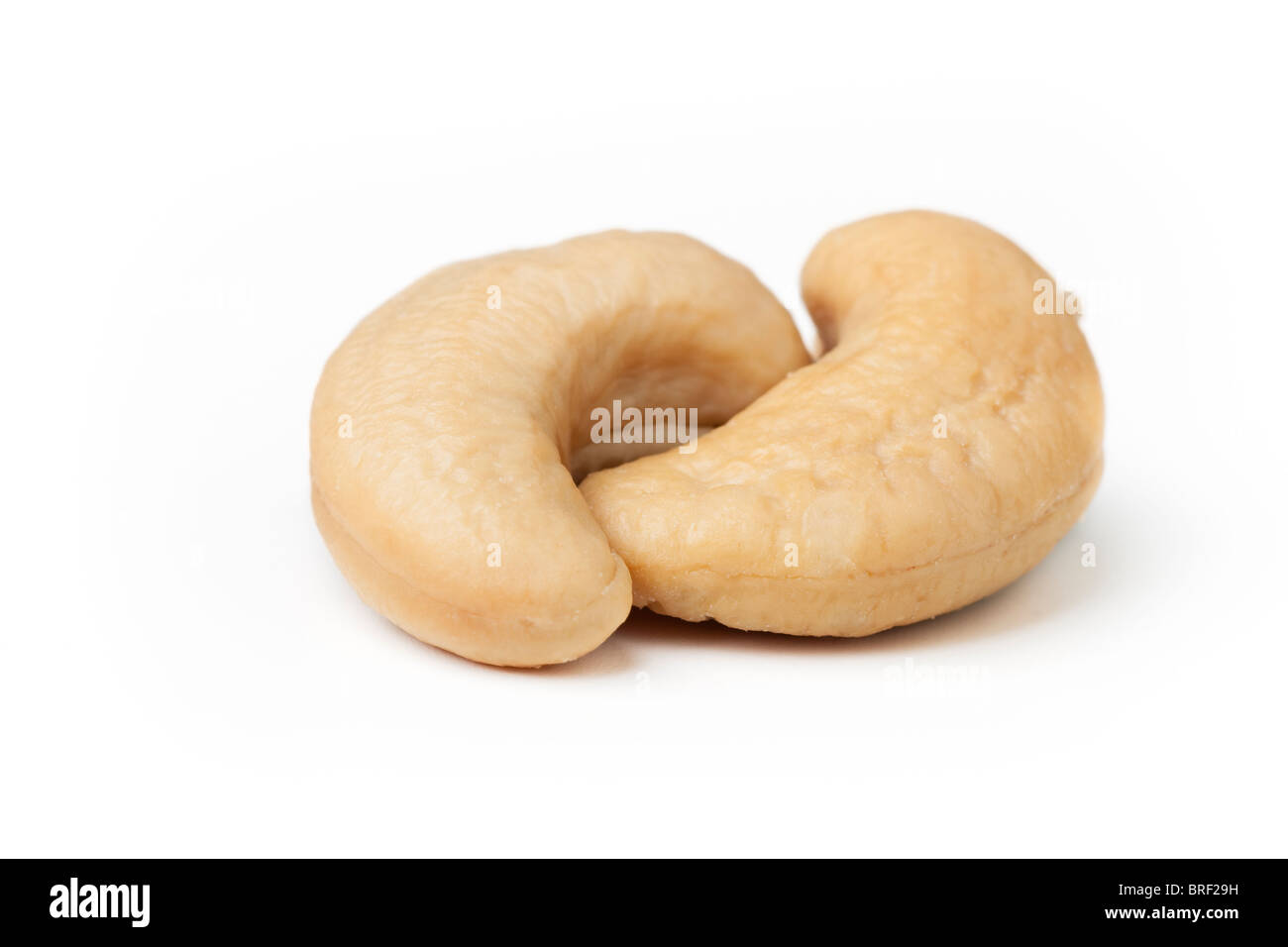 Two cashew nuts on white background Stock Photo - Alamy