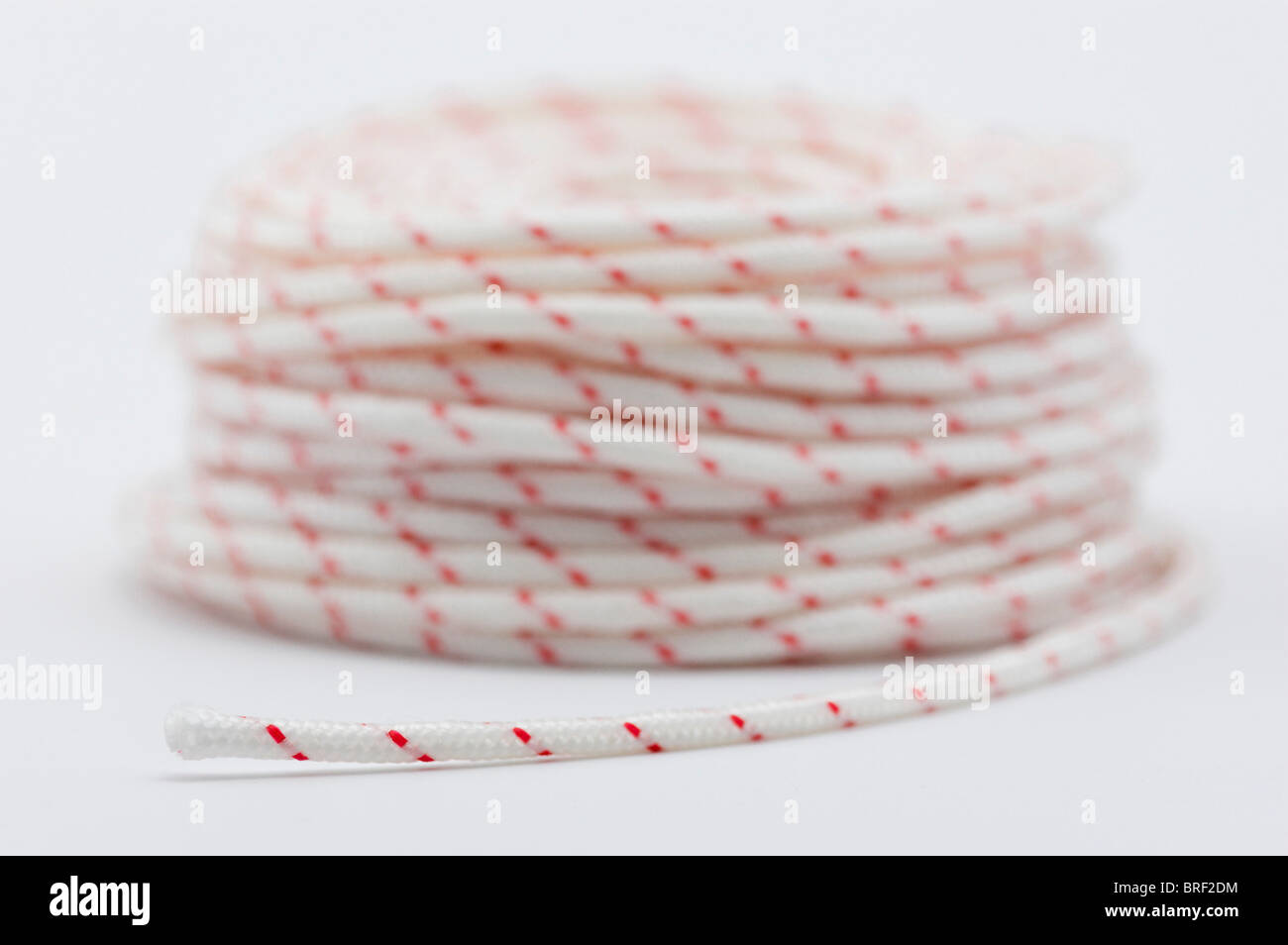 Bundle of white, nylon laundry rope Stock Photo - Alamy