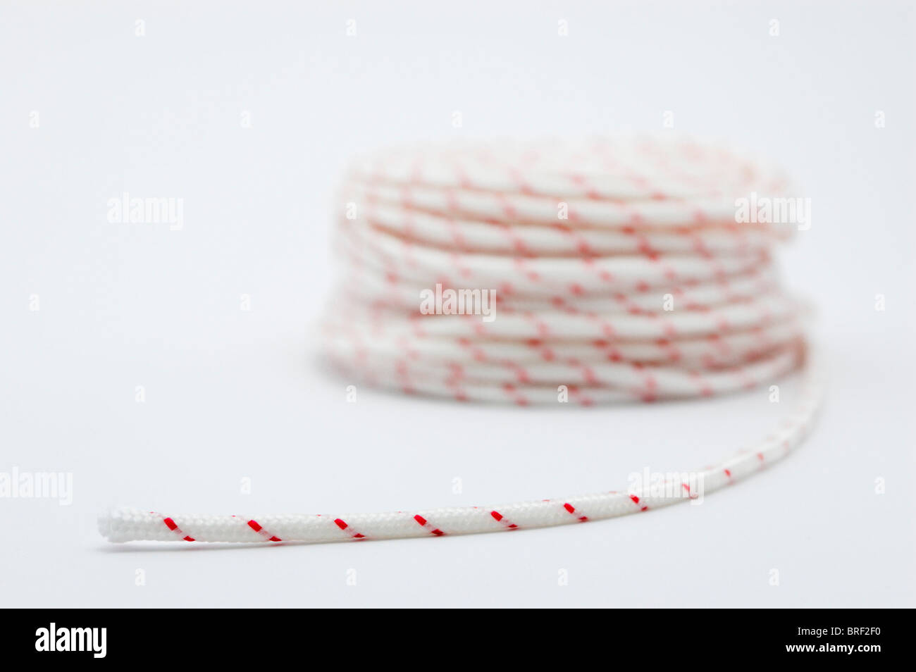 Bundle of white, nylon laundry rope Stock Photo - Alamy