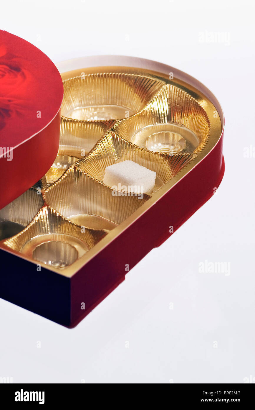 Sugar cube in a chocolate box Stock Photo - Alamy