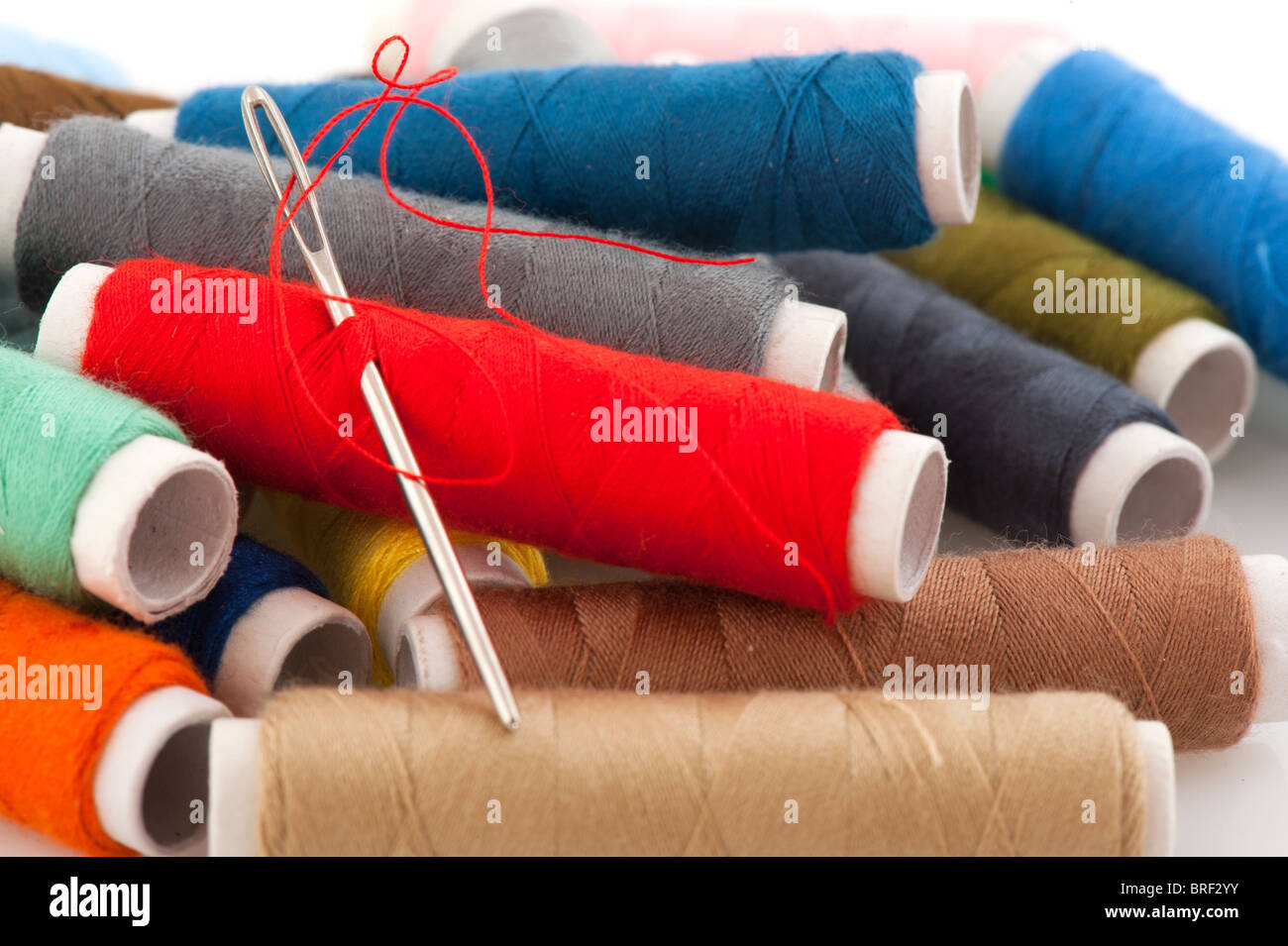 colorful threads on spools Stock Photo - Alamy