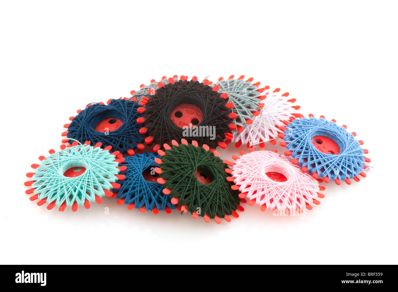 colorful threads on spools Stock Photo - Alamy