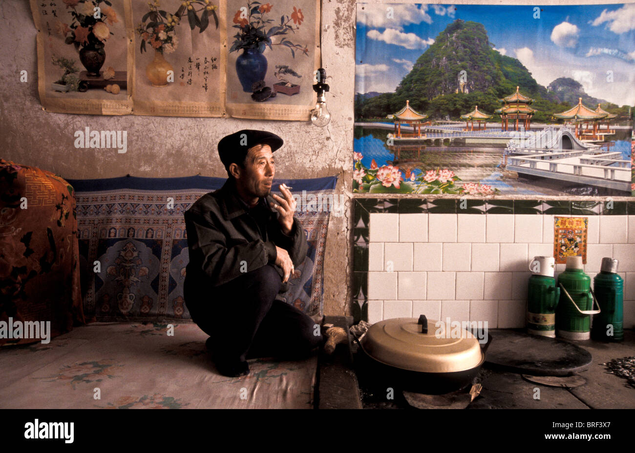 Chang Lin has a mid morning break from work in Chang Qu village. He ...