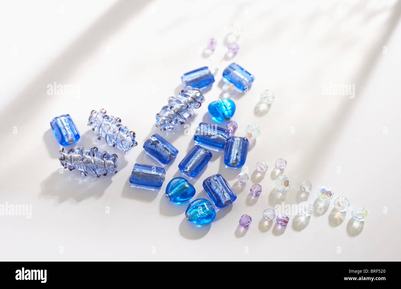 Group of blue, purple and translucent beads Stock Photo - Alamy